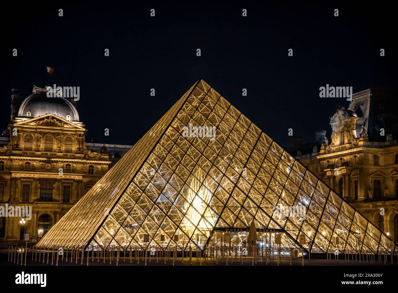Illuminated Louvre Pyramid and Museum at Night - Paris, France Stock ...