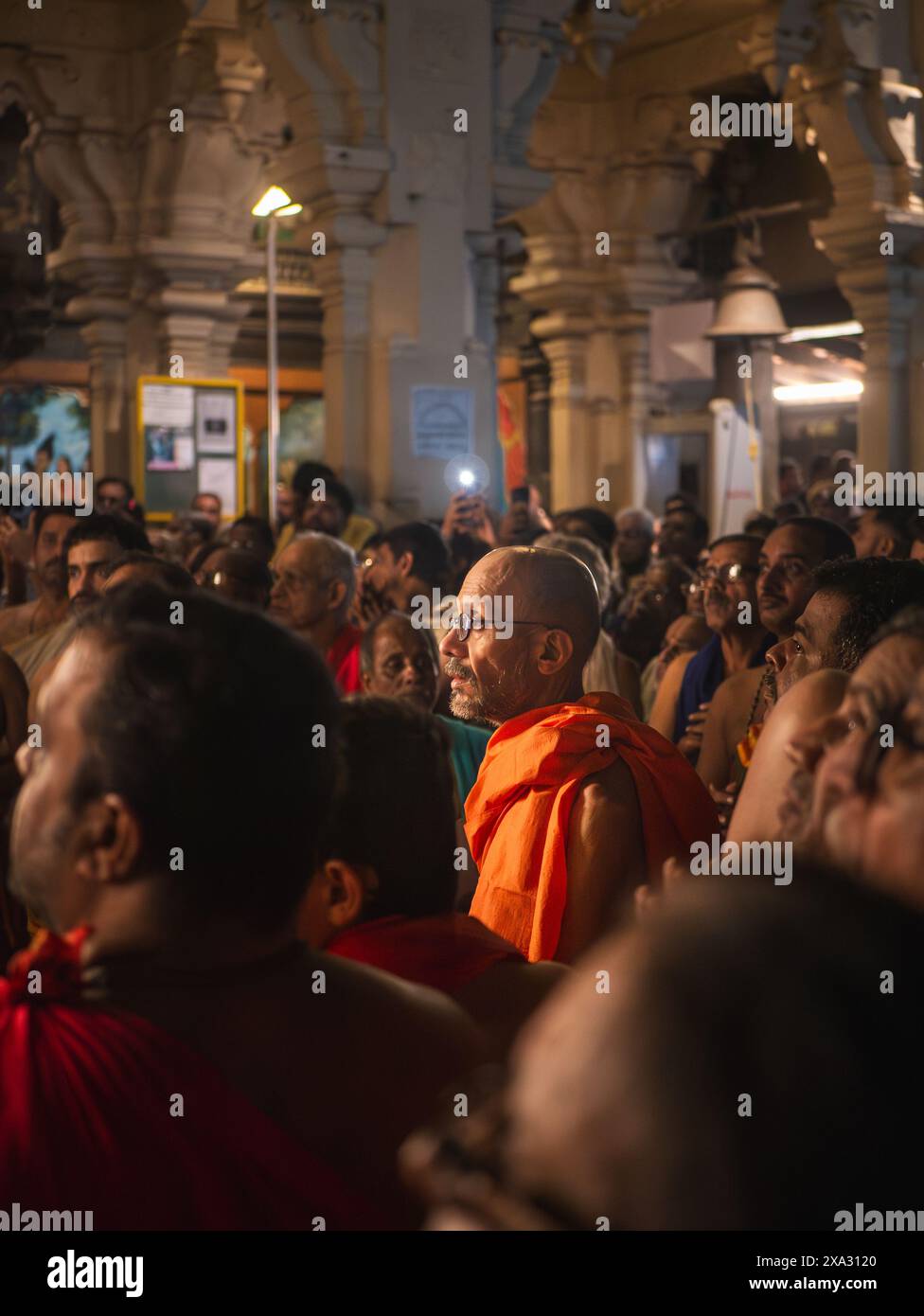 Udupi, INDIA - December 26, 2024 : Temple priest during Krishna temple rath yatra where large ...