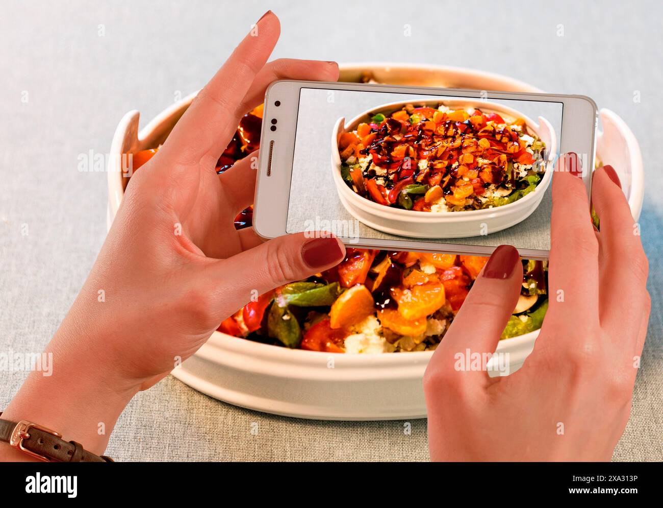 Photographing the food with your mobile phone Stock Photo - Alamy