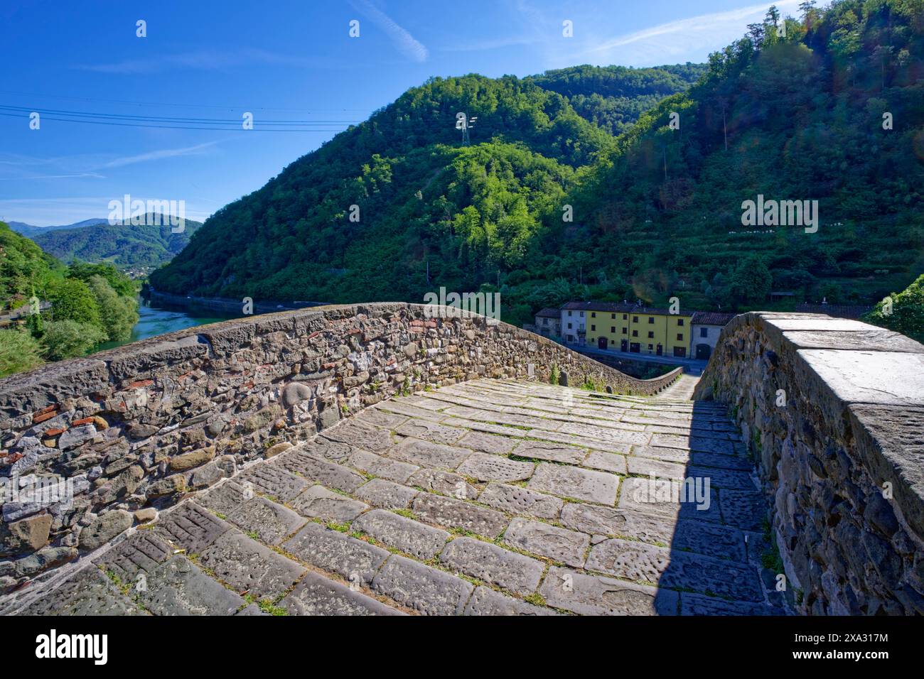 The historic Ponte della Maddalena bridge over the River Serchio in ...