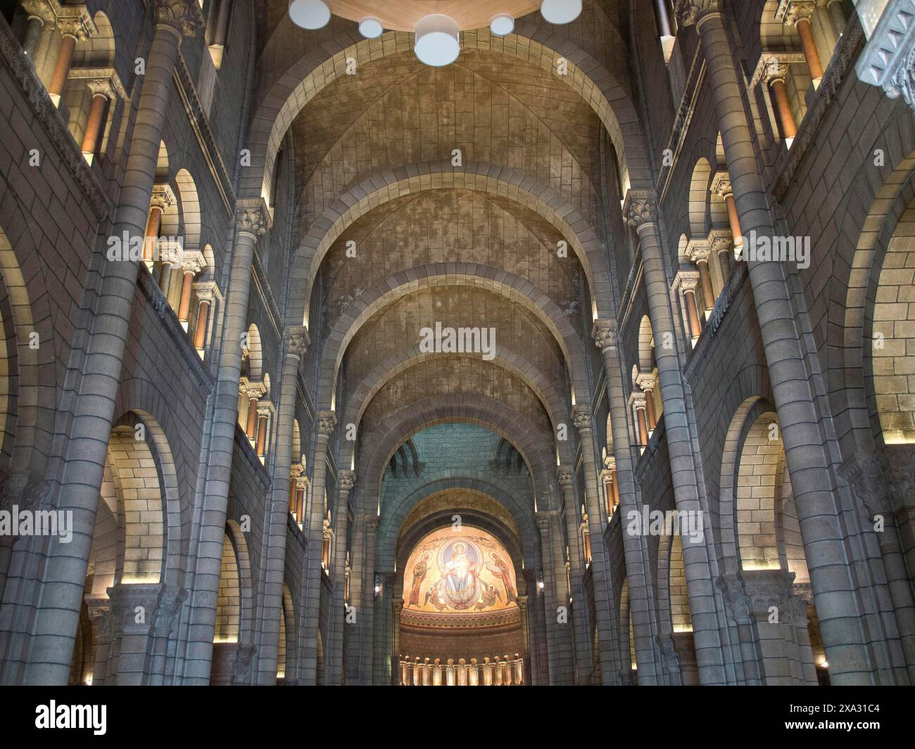 Impressive church interior with stone arches, vaults and ceiling mosaic ...