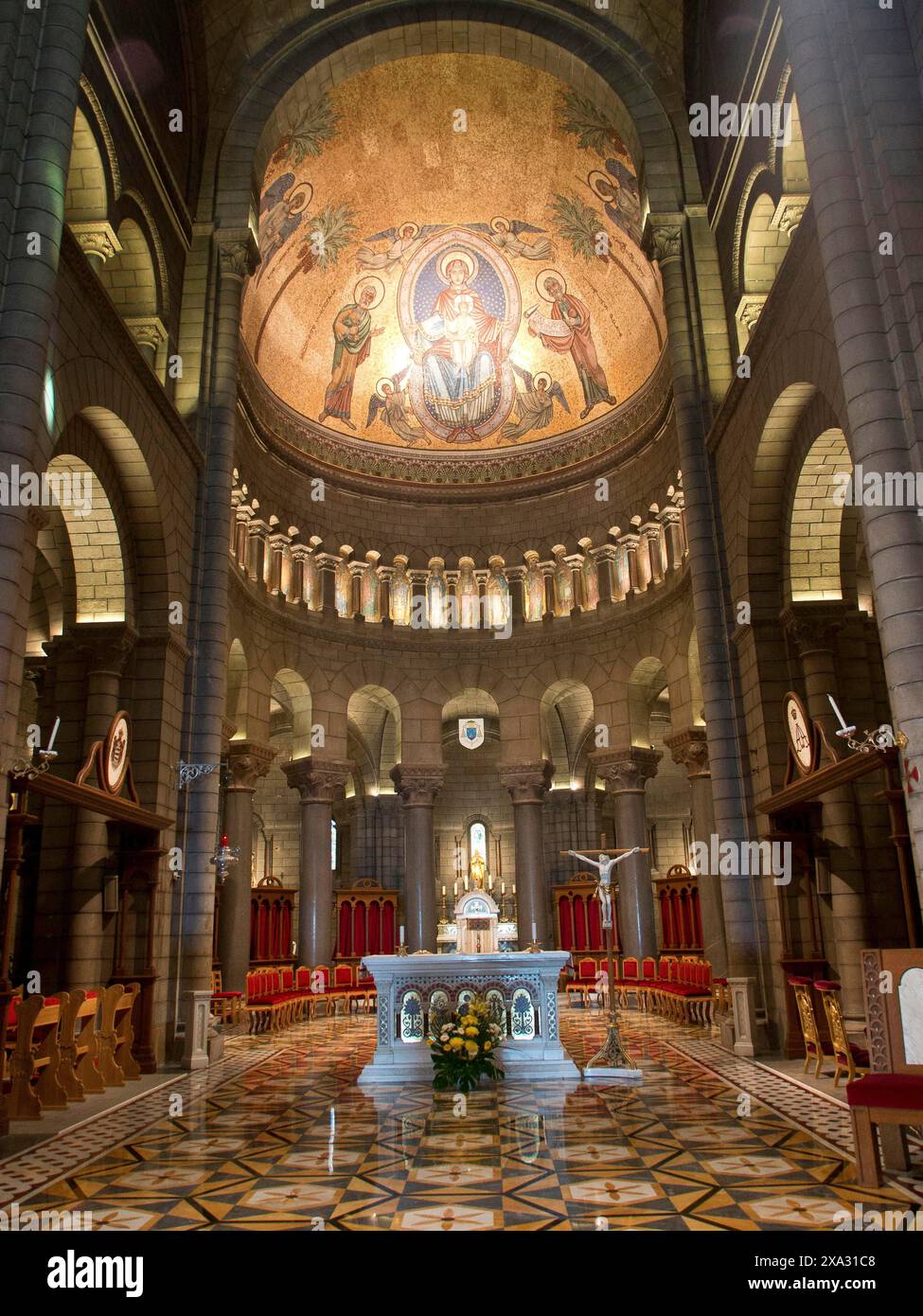 Sacred church interior with mosaic, arches and festively decorated altar, Monte Carlo, Monaco ...