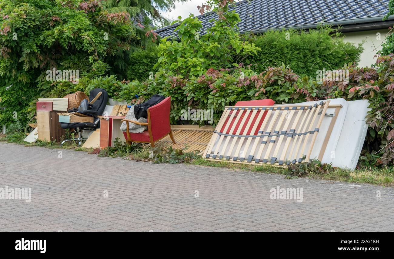 Pile of bulky waste on the side of the road with wooden furniture ...