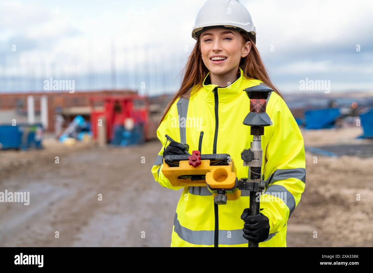 Female site engineer surveyor working with theodolite total station EDM ...