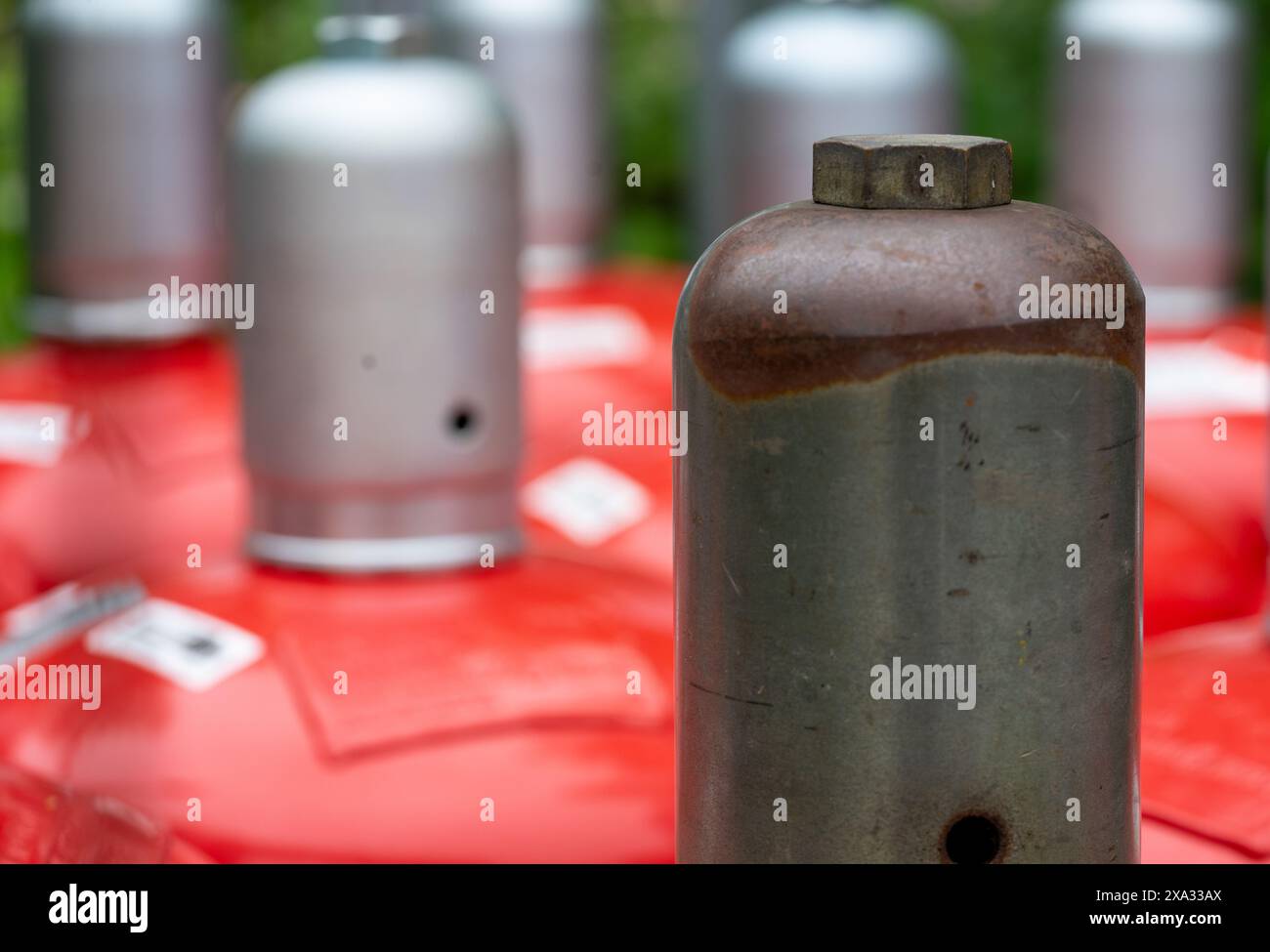 Red propane gas bottles for refilling Stock Photo - Alamy