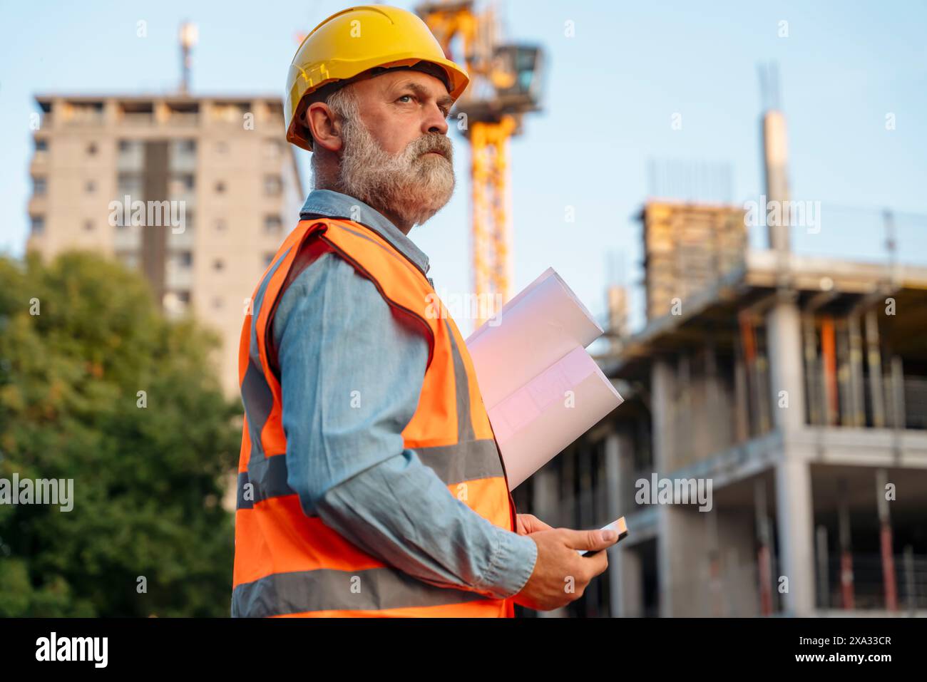 A man site engineer surveyor working with theodolite total station EDM ...