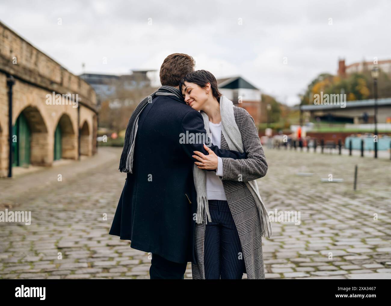 Handsome man and beautiful woman falling in love, hugging each other ...