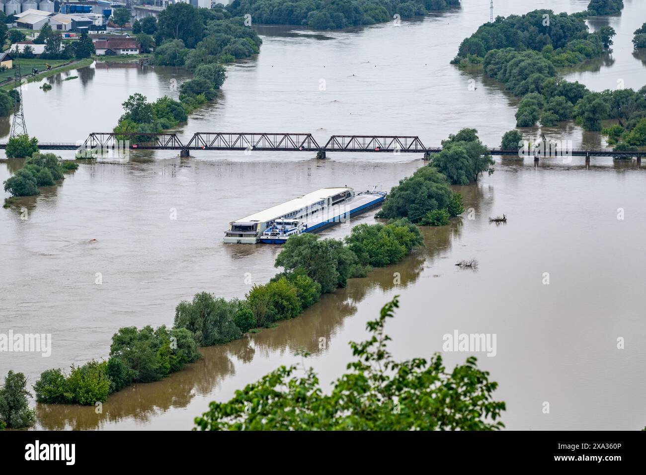 Bogen, Germany. 04th June, 2024. Two ships lie in the flood waters of ...