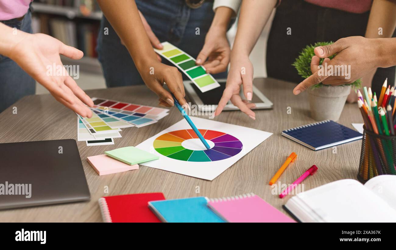 Group of graphic designers choosing color swatch samples Stock Photo ...