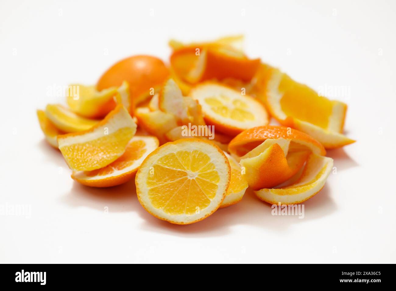 Orange sections and peels on a white background Stock Photo - Alamy