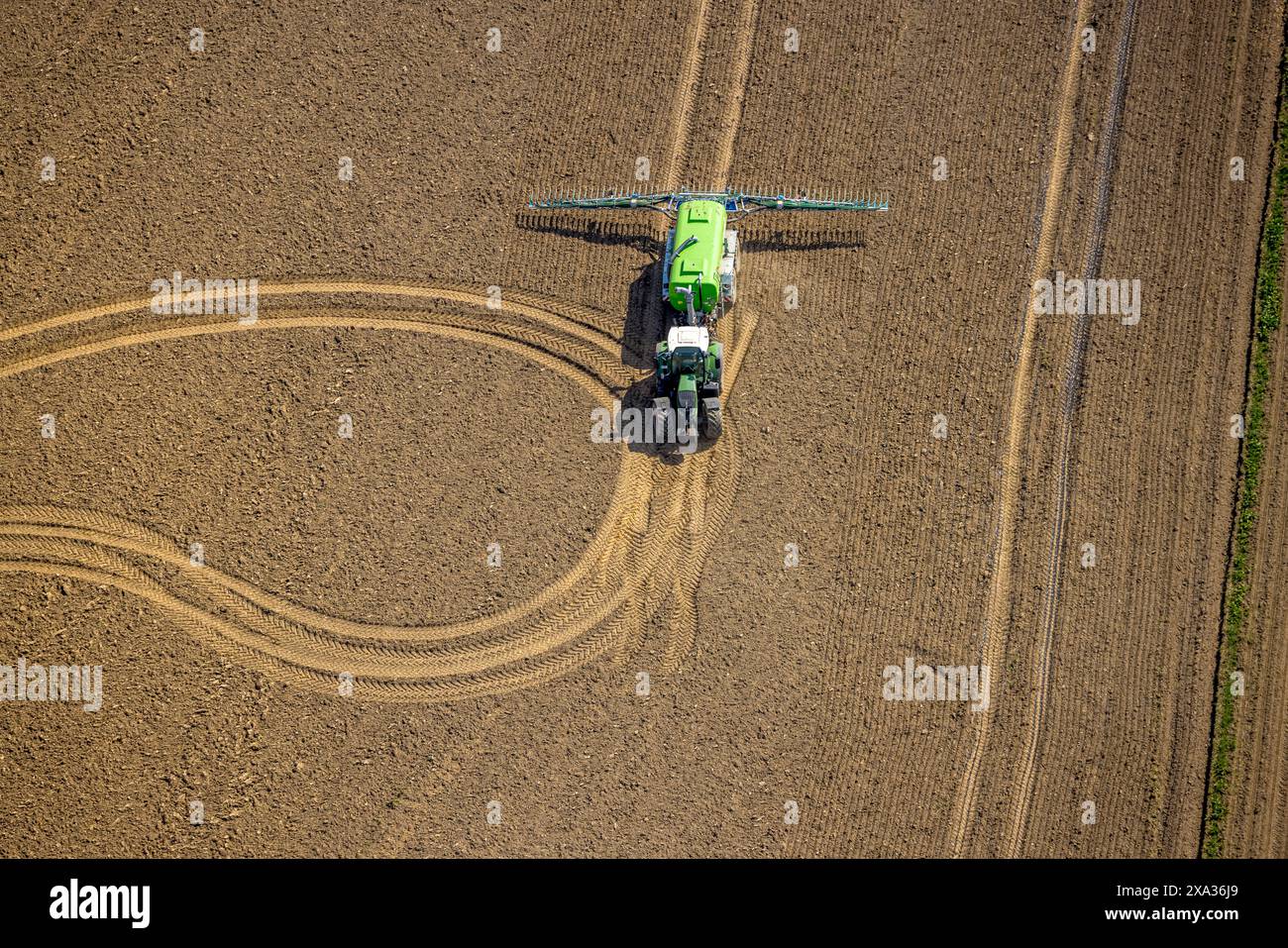 Aerial view, agricultural land, tractor and agricultural machine ...