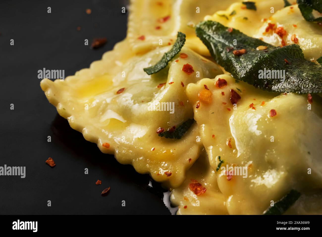 Ravioli with spinach and ricotta filling and sage butter Stock Photo ...