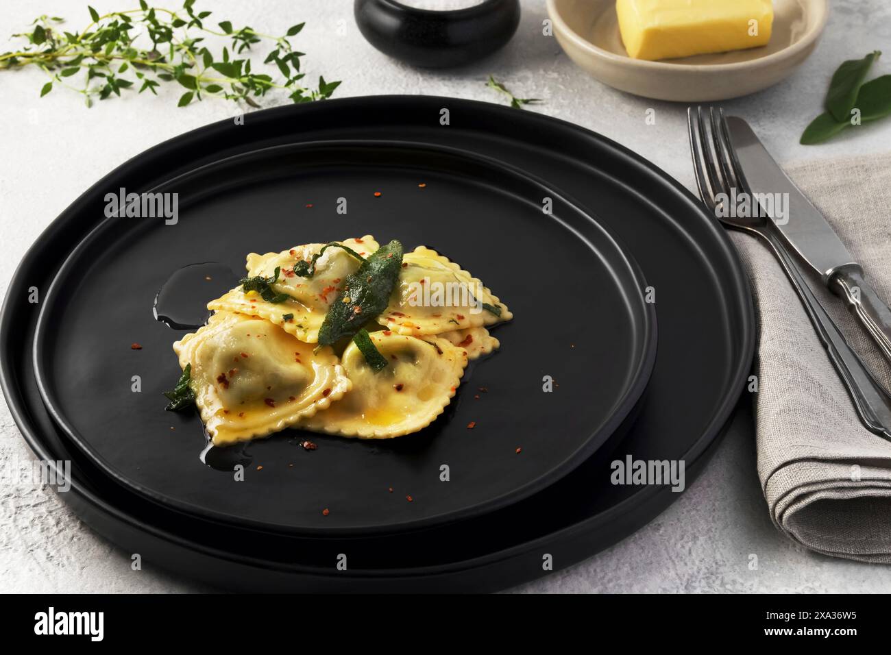 Ravioli with spinach and ricotta filling and sage butter Stock Photo ...