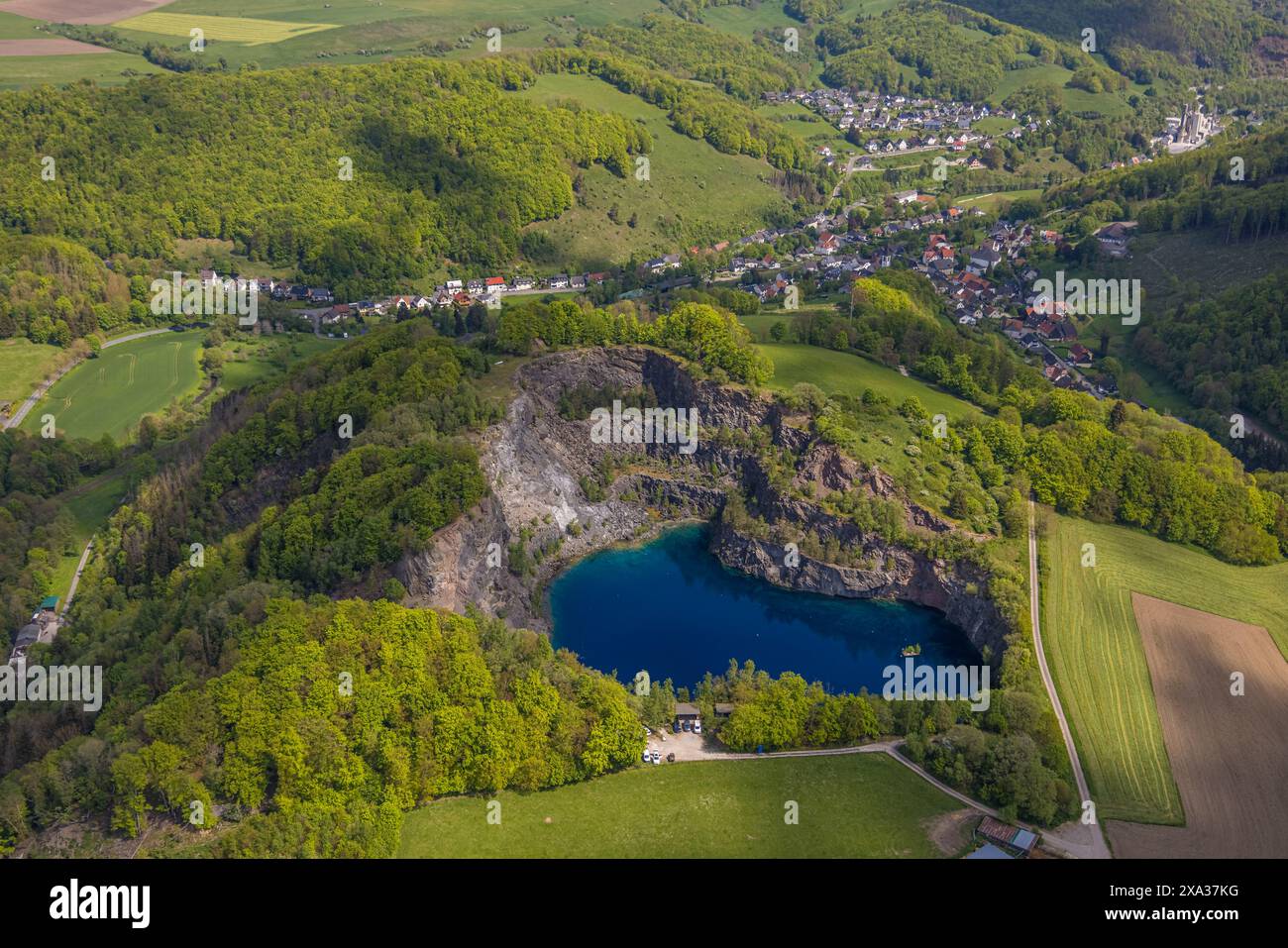 Aerial view, lake in the mountain, circular quarry lake, diving water ...