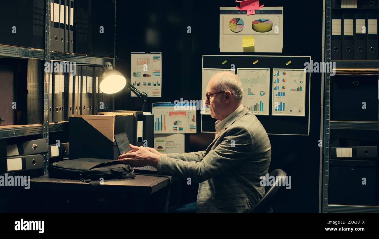 Senior investigator studying archive folders for case similarities ...