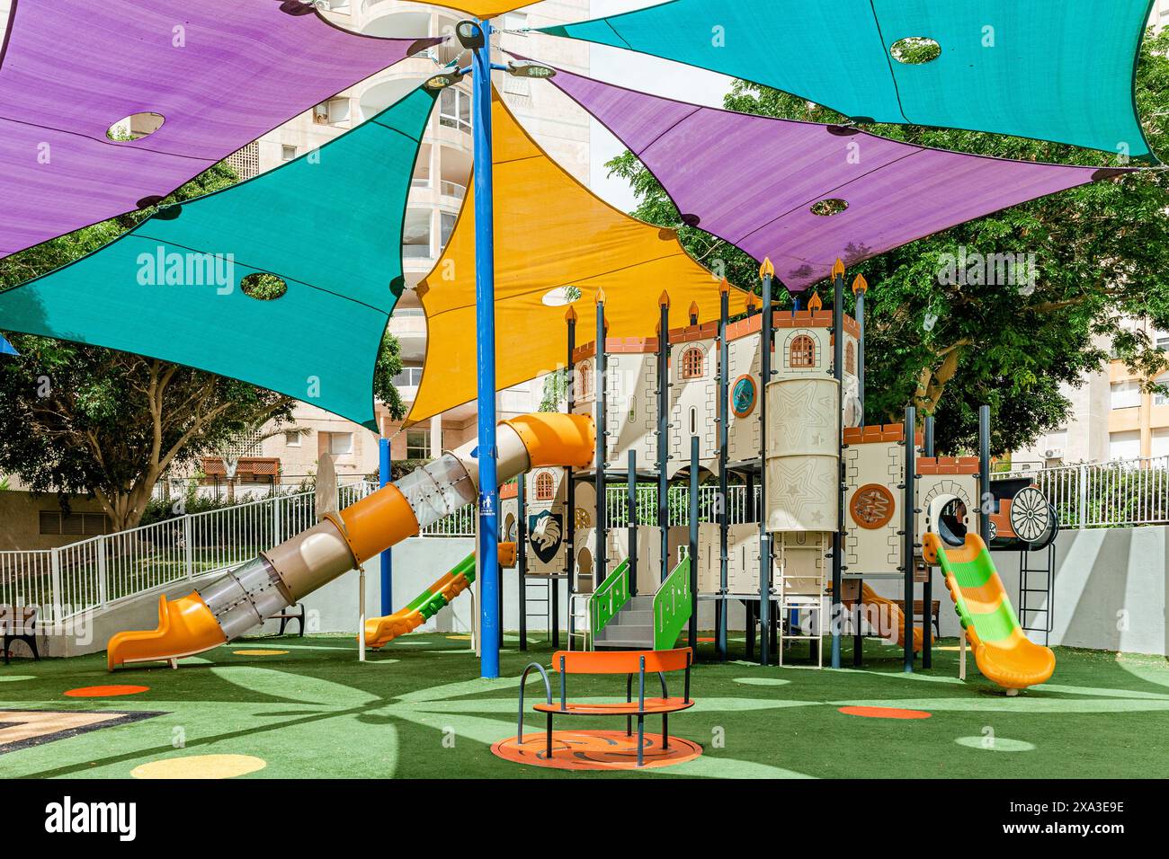 Modern colorful children's playground with canopy. Children's castle ...
