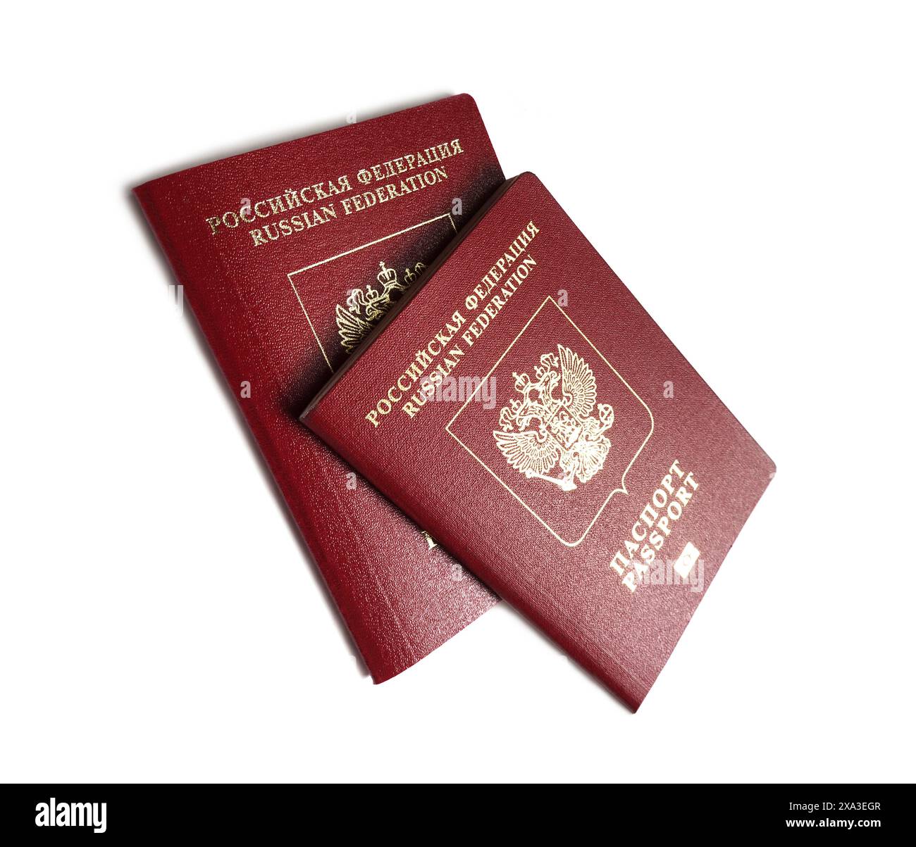 Two red russian foreign passports over white background studio shot ...