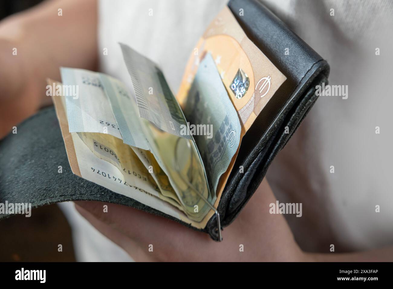 child holding wallet, takes out euro, theft money, managing pocket ...