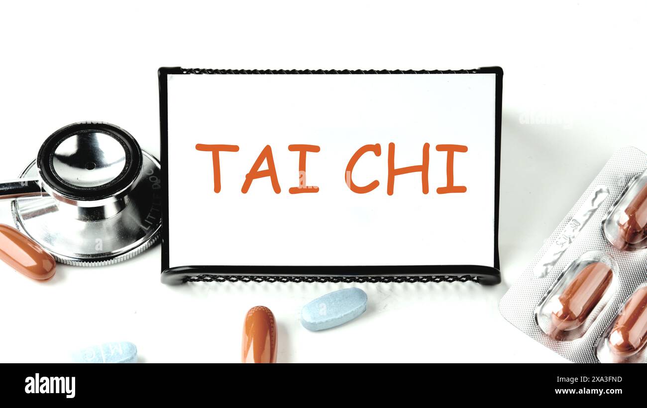 Tai Chi Word on a white business card on a stand on a white background ...