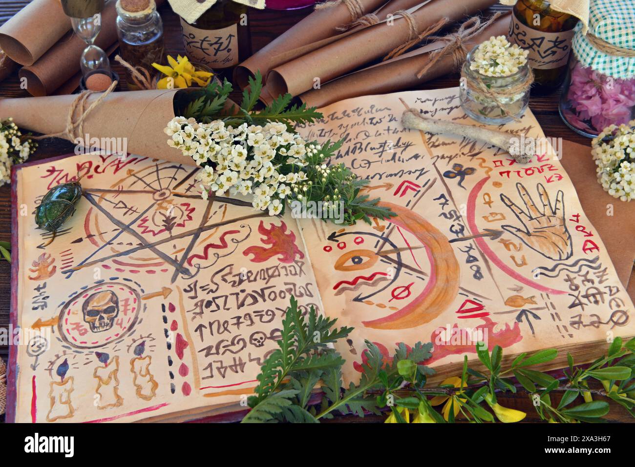 Mystic still life with magic book of spells, healing herbs and witchy ...