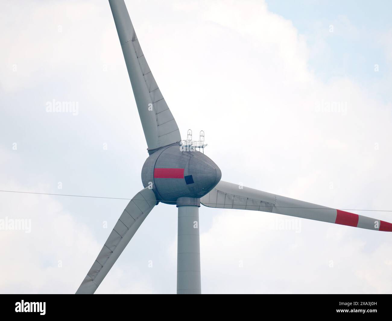 A wind turbine blade spins tirelessly, harnessing the power of the wind to generate renewable ...