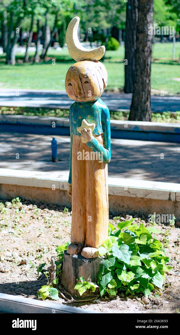 Wooden statue carved out of a tree stump, Jannat park, Shiraz, Iran ...
