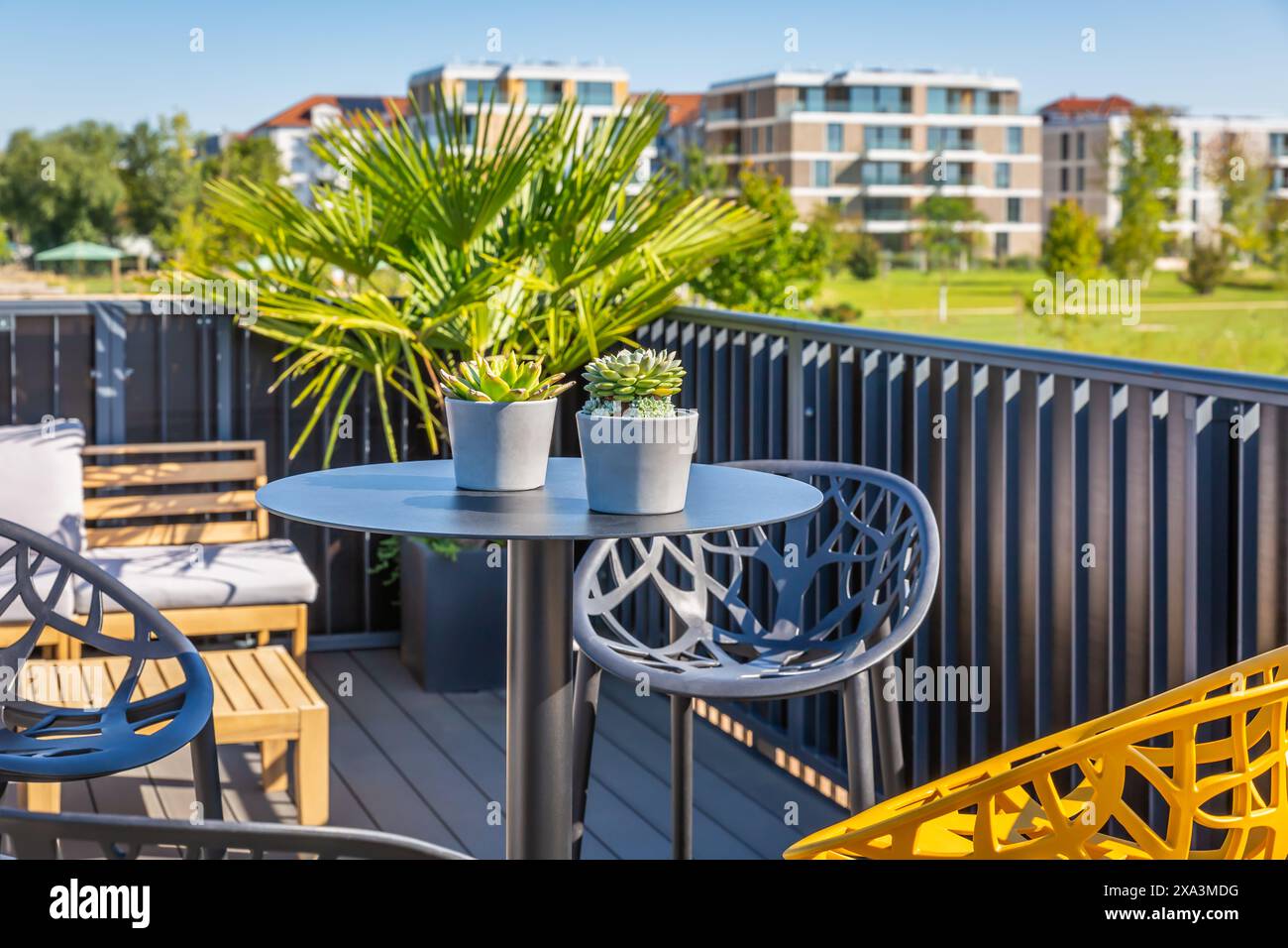 Sitting and relaxing area on roof of modern city house with green ...