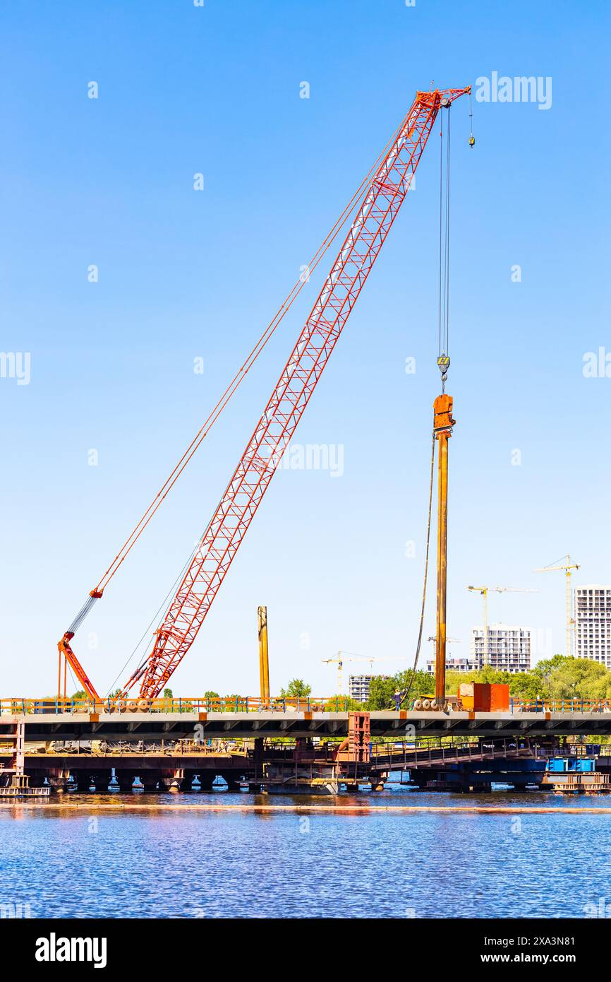 Moscow, Russia - May 22, 2024: floating crane building a bridge. using ...