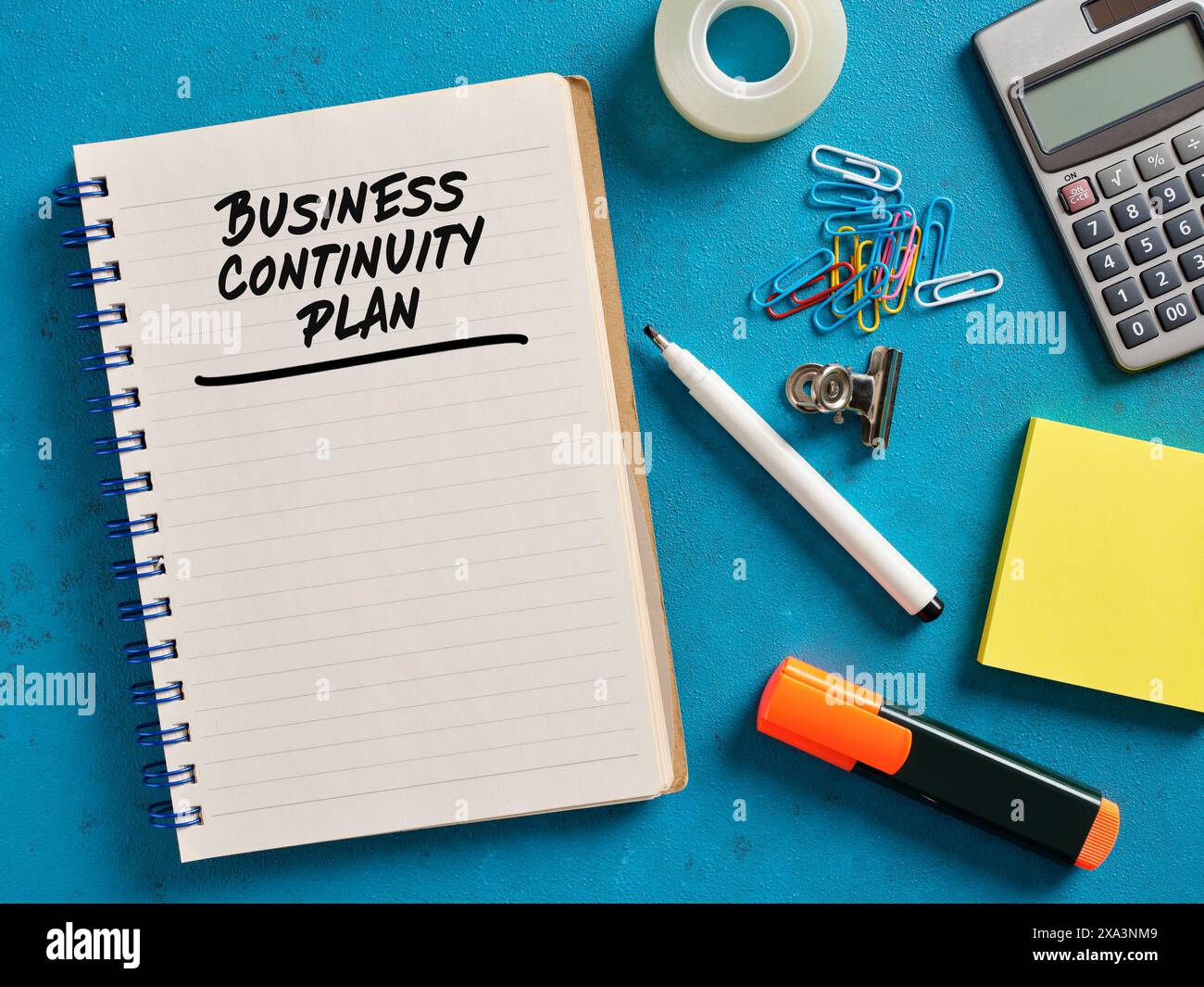 Handwritten business continuity plan BCP on a notebook. The process of ...