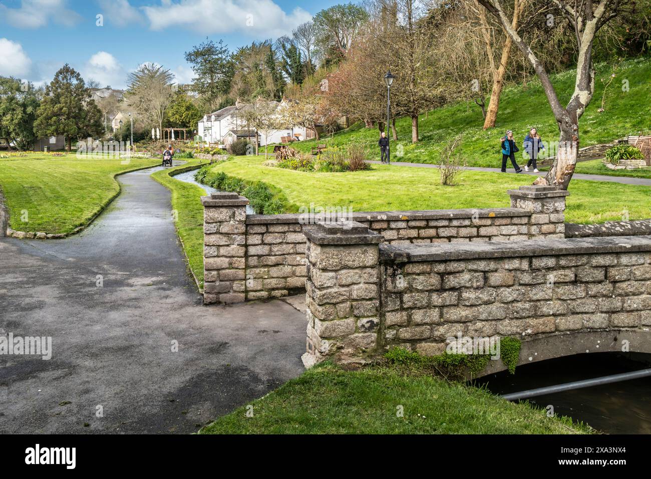 A small footbridge over the river stream flowing through the historic ...