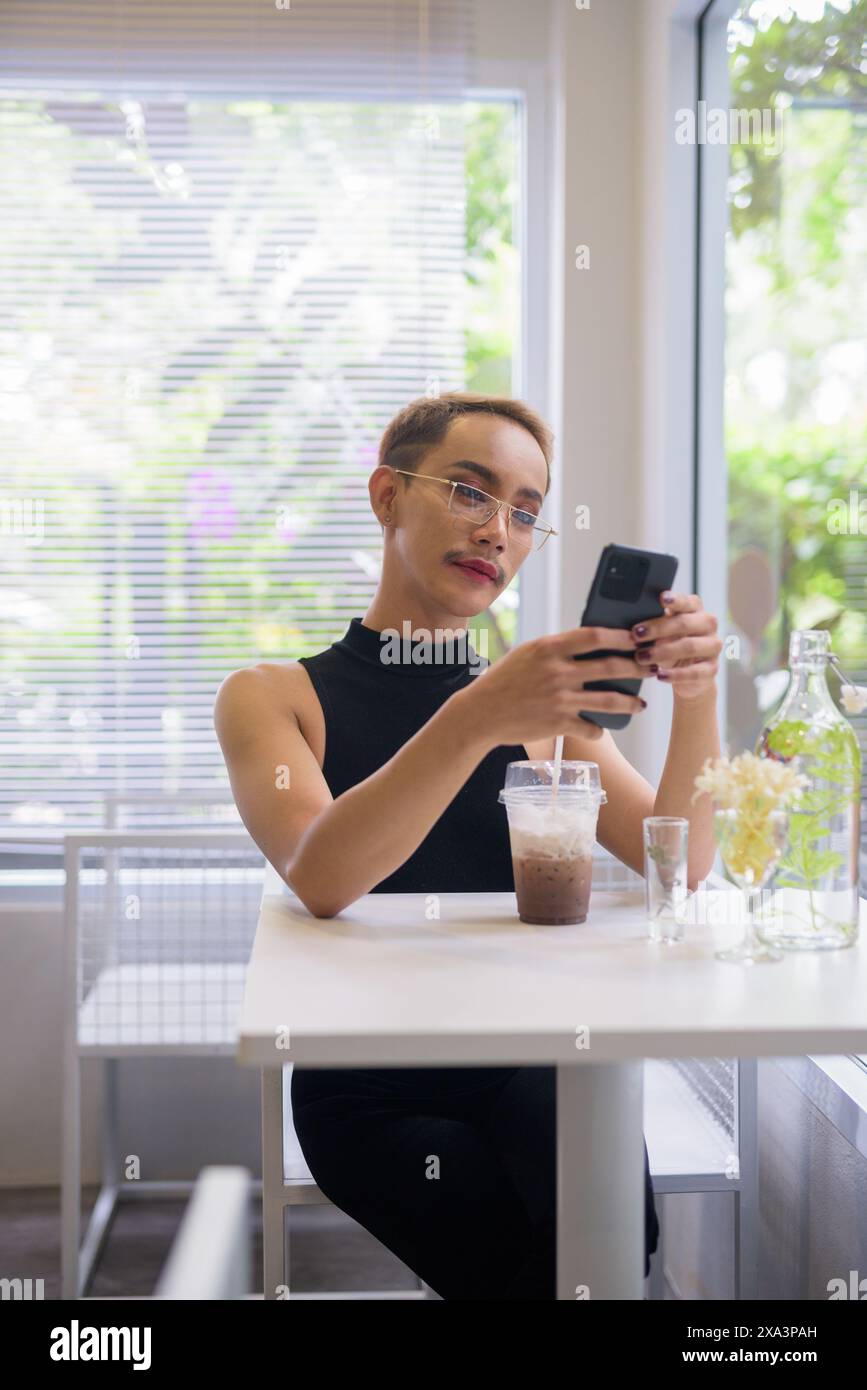Portrait of beautiful Asian queer LGBT community supporter man with ...