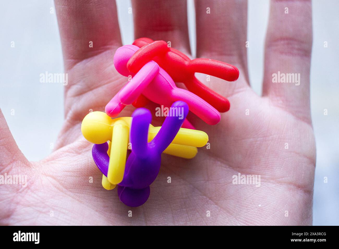 Concept of conflict or fight - 4 small plastic figures in position of ...