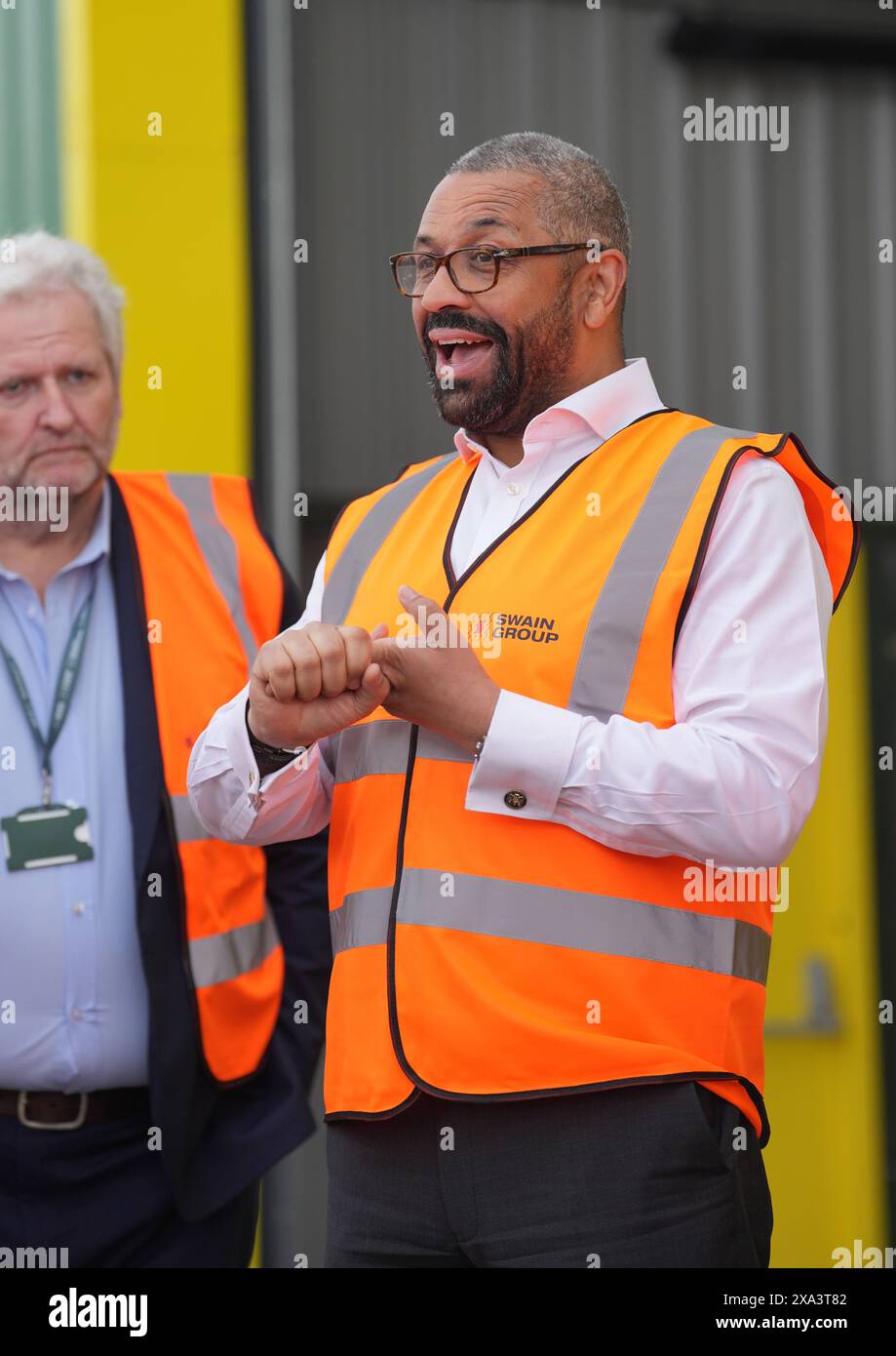 Home Secretary James Cleverly dons a hi-vis vest during a visit to ...