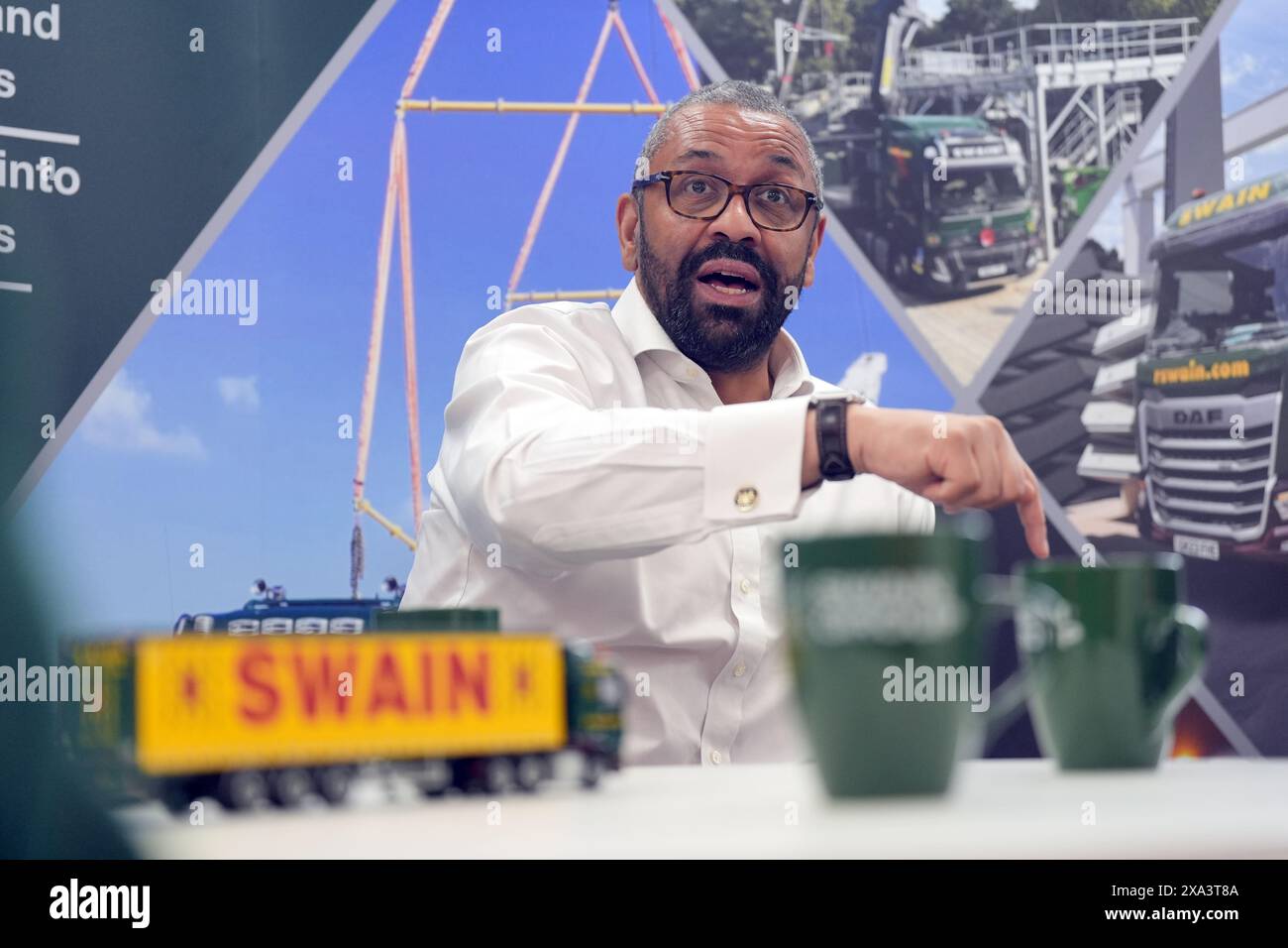 Home Secretary James Cleverly meeting staff during a visit to Swain ...