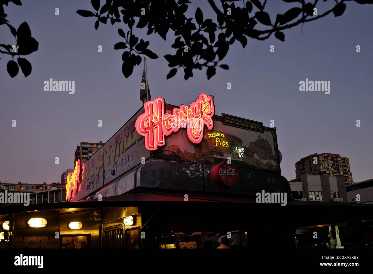 Harry's pink neon sign at the famous Cafe De Wheels pie cart caravan at ...