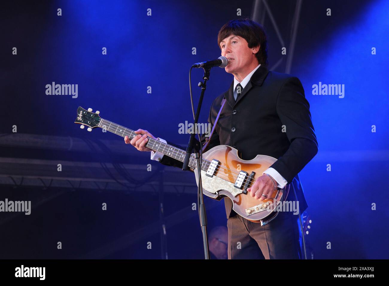 Steve White (Paul McCartney) of The Bootleg Beatles performing at Wychwood Festival, Cheltenham ...