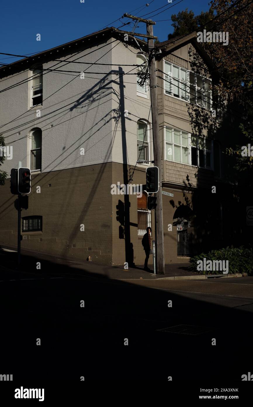 Inner city street scene, a large terrace house, telegraph pole and ...