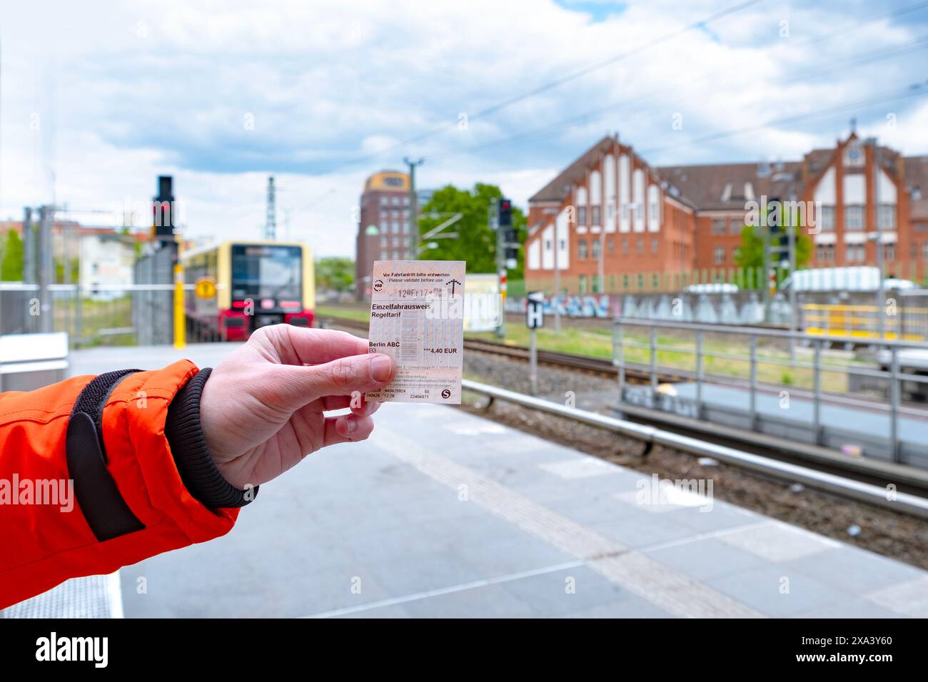 Deutsche Bahn regional train arrives at Berlin station, ticket in hand ...