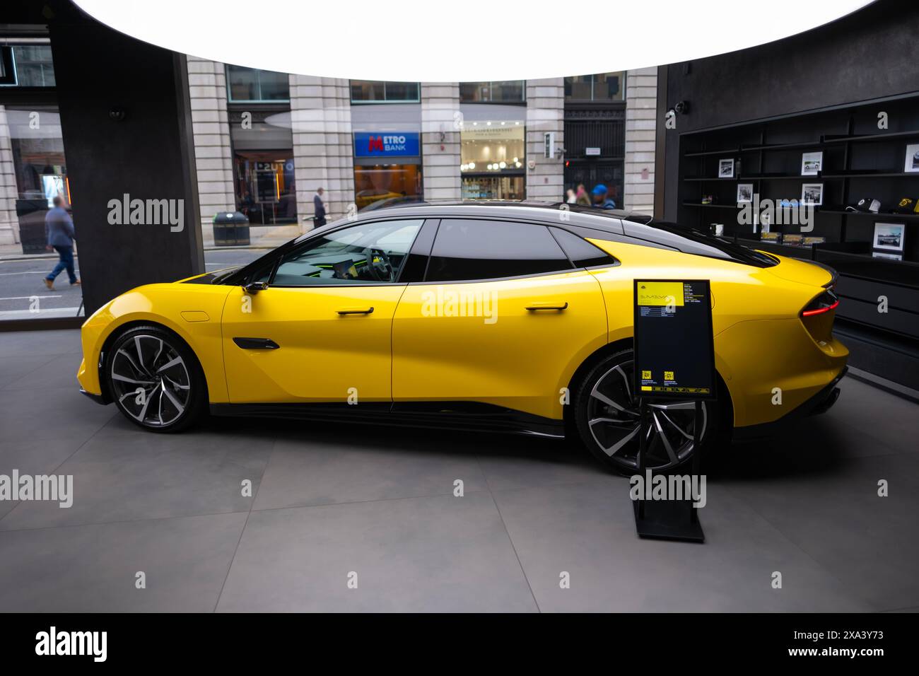 new yellow battery-Electric Hyper-GT Lotus Emeya in showroom, British ...