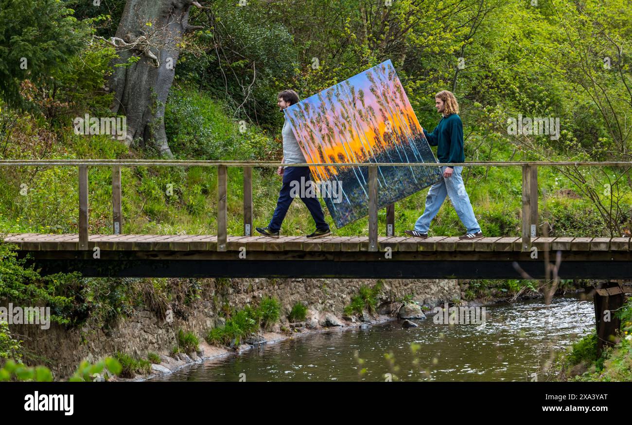 Artist Joe Grieve with one of his large colourful paintings at the ...
