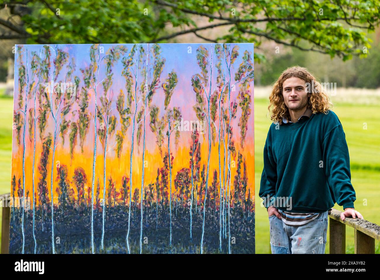 Artist Joe Grieve with one of his large colourful paintings at the ...