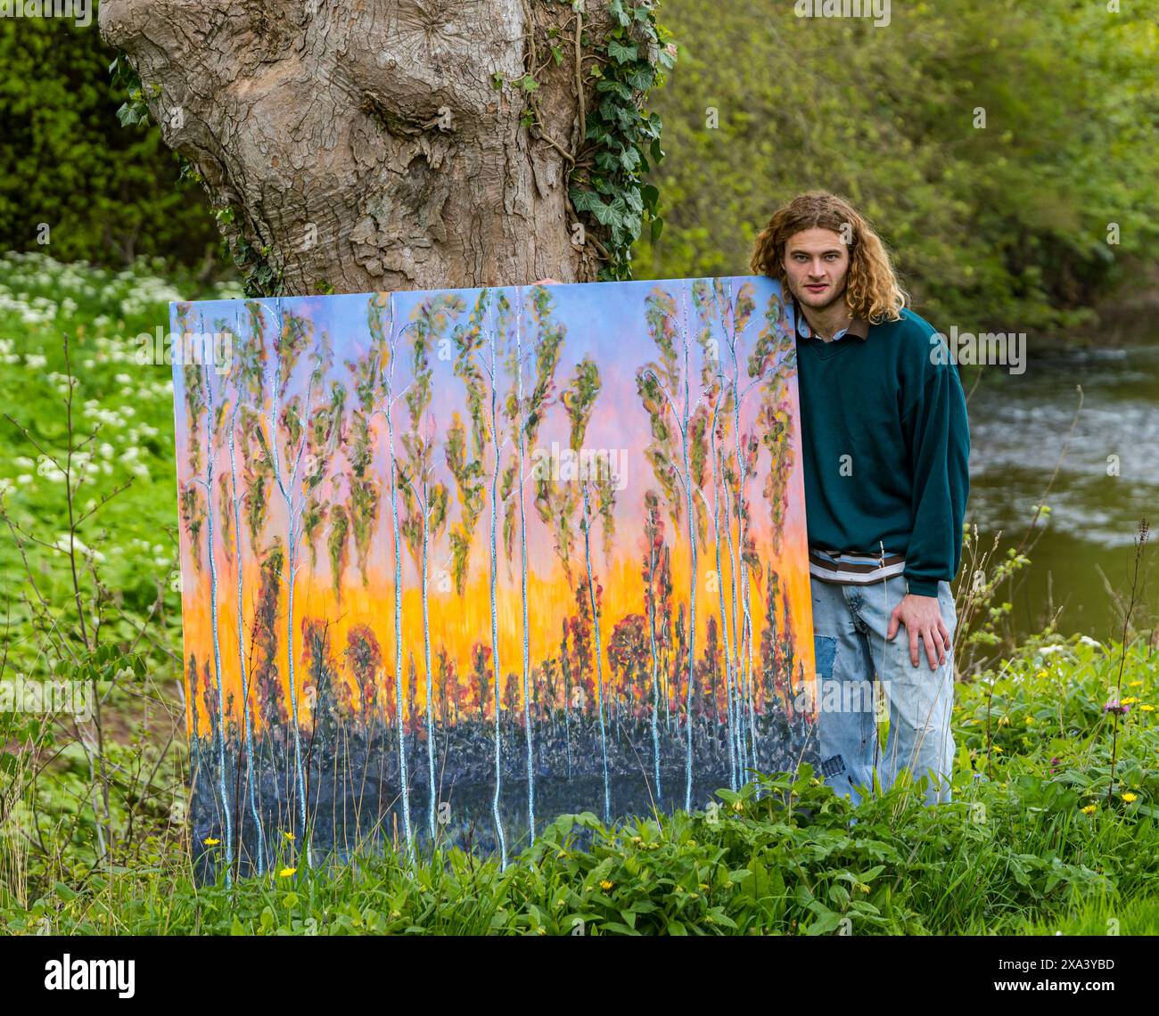 Artist Joe Grieve with one of his large colourful paintings at the ...