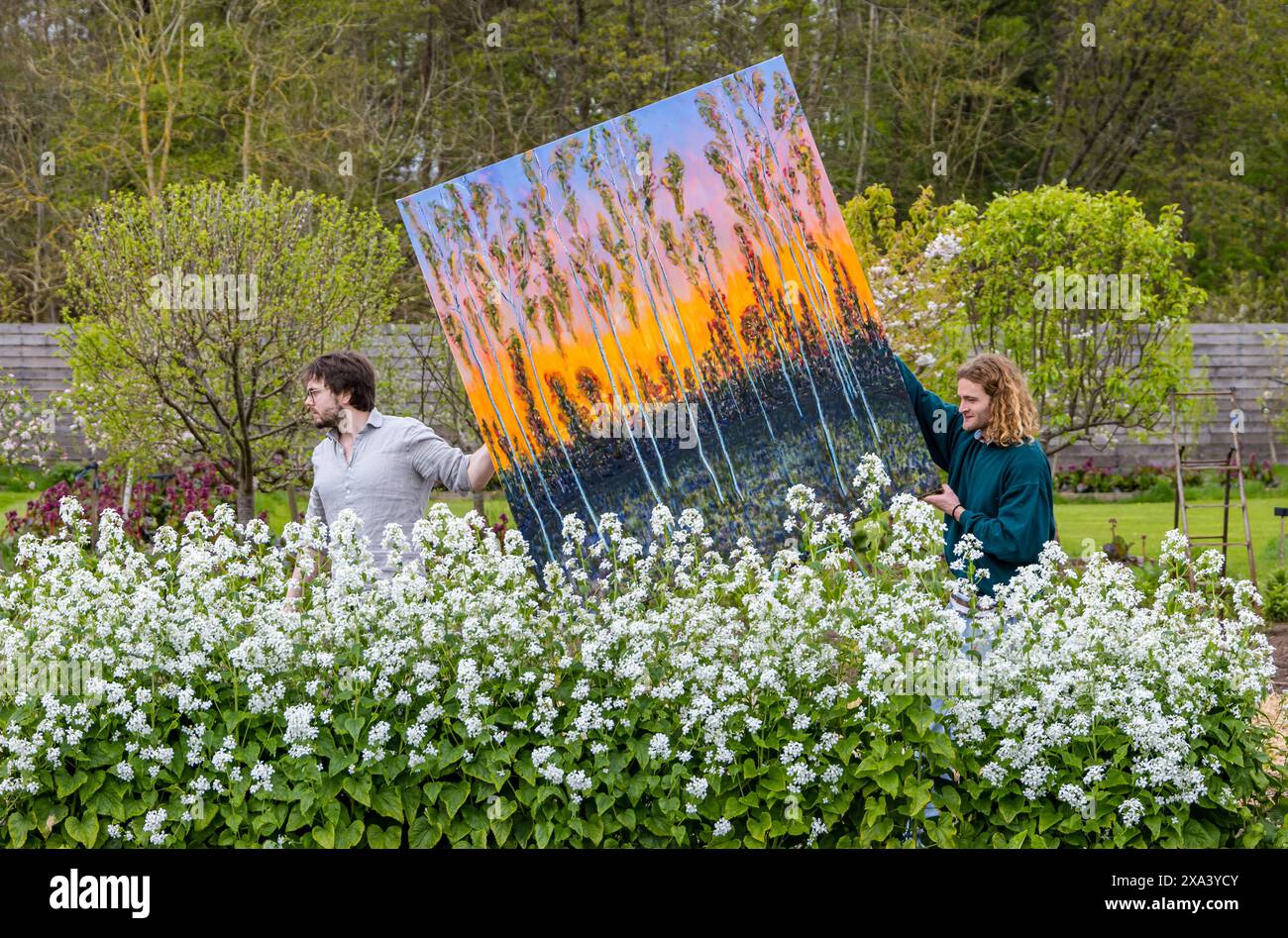 Artist Joe Grieve with one of his large colourful paintings at the ...