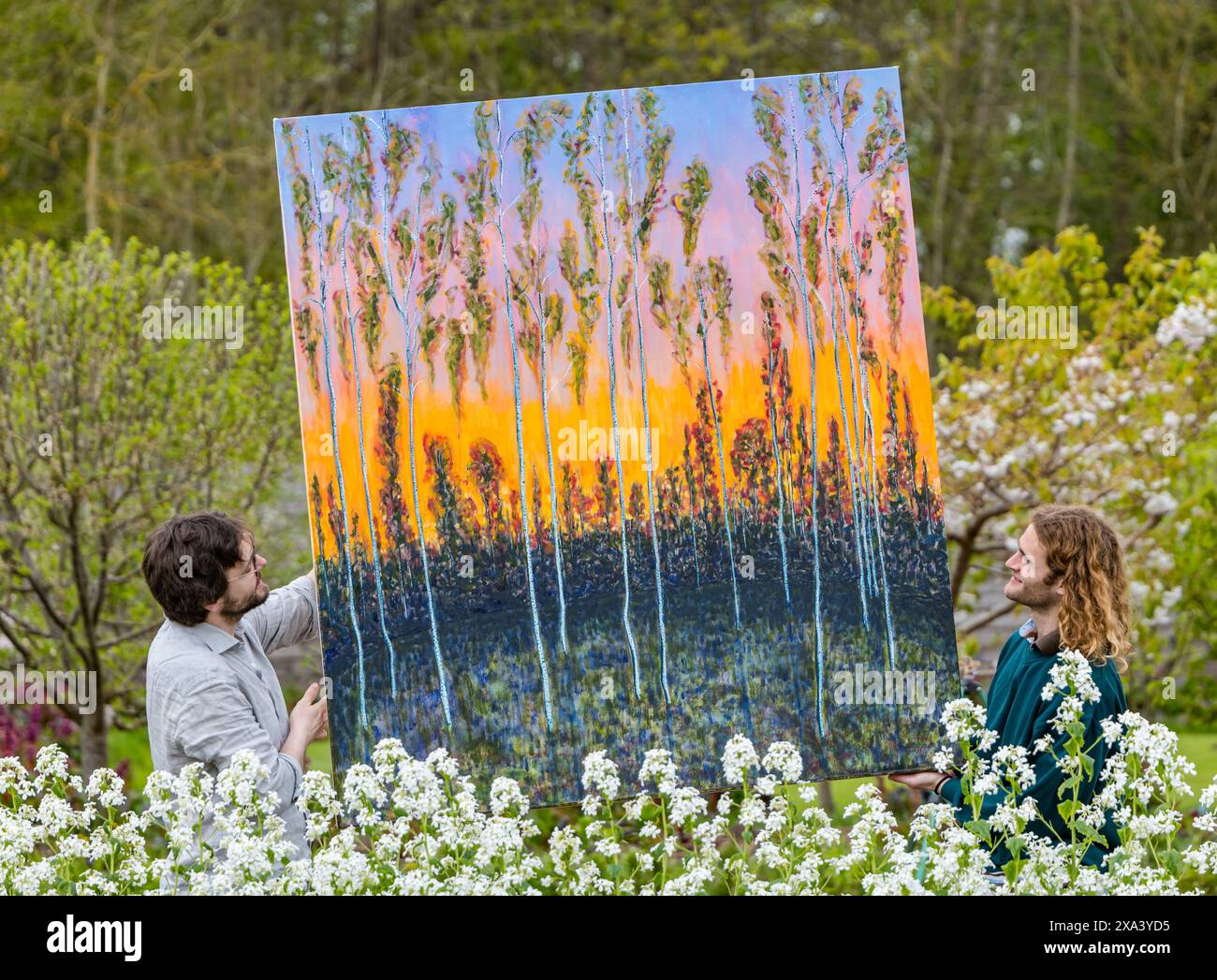 Artist Joe Grieve with one of his large colourful paintings at the ...