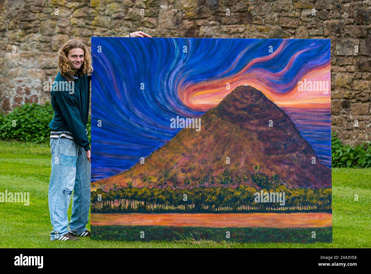 Artist Joe Grieve with one of his large colourful paintings at the ...