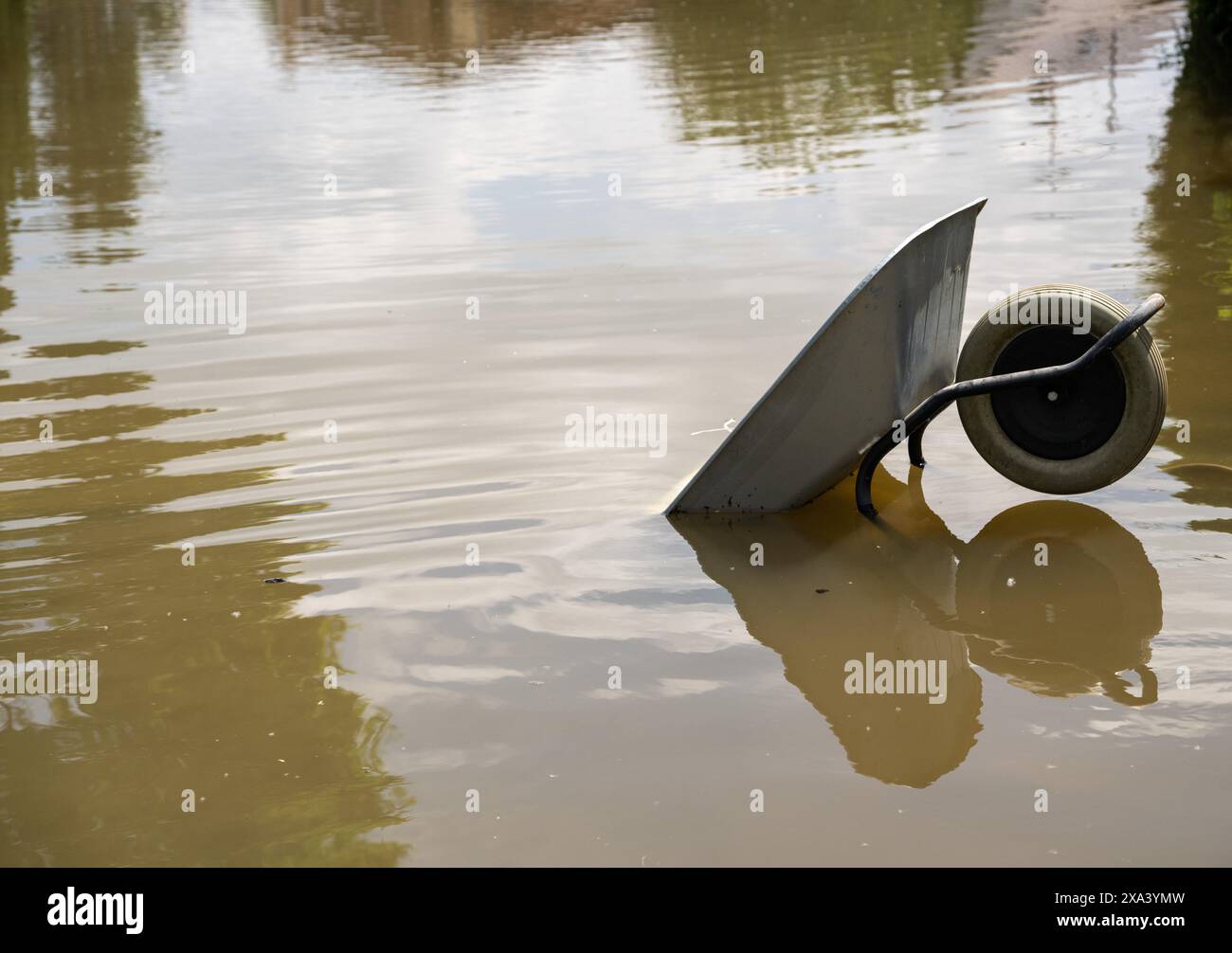 Offingen, Germany. 04th June, 2024. A washed up wheelbarrow is ...