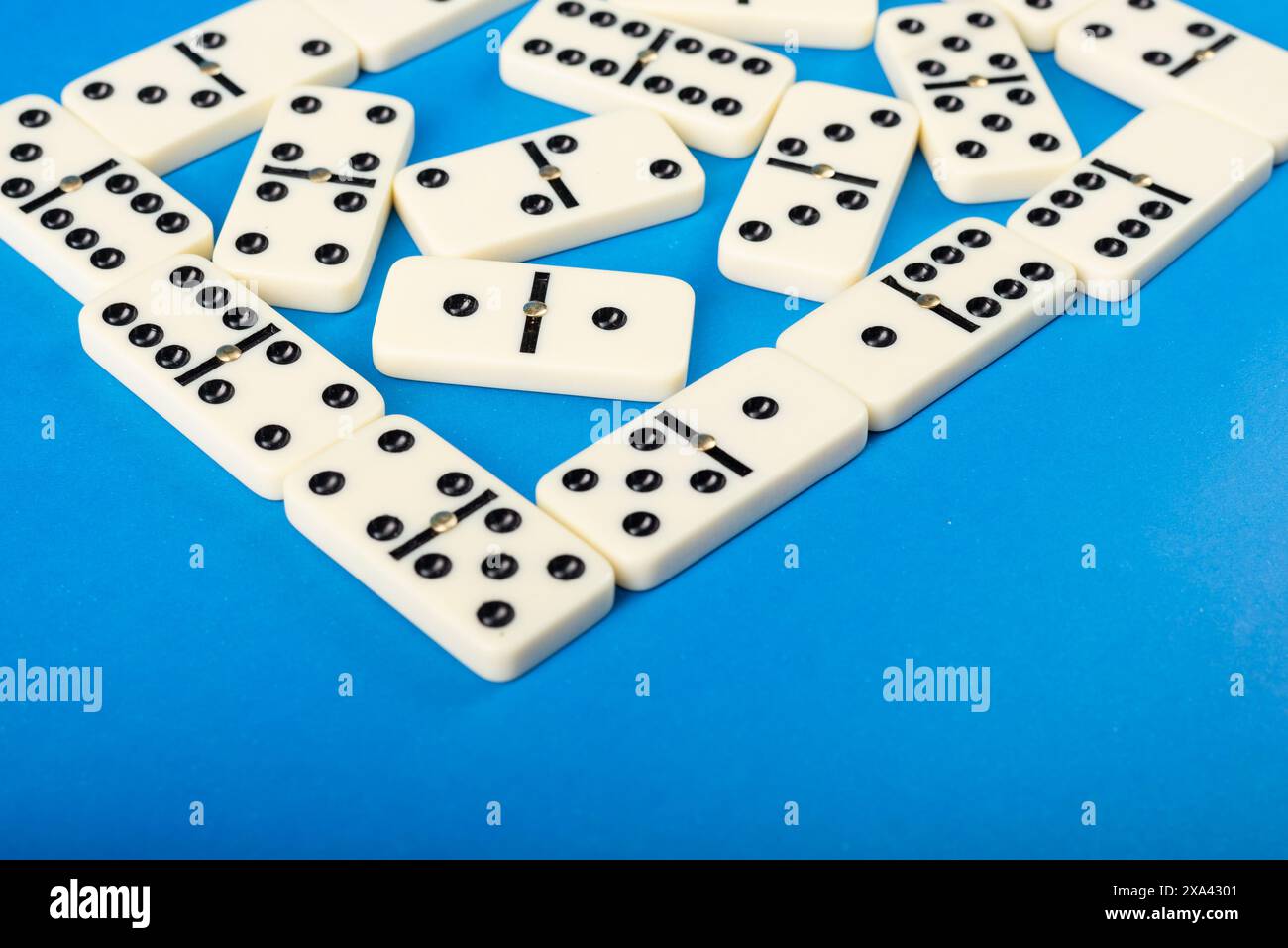 Connected dominoes on a blue background. board games concept Stock ...