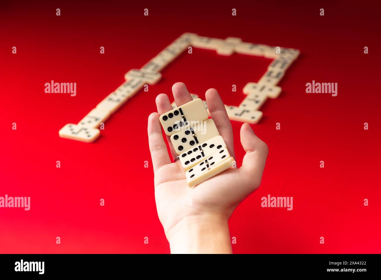 Domino player holding rectangular number acrylic pieces. Board game ...