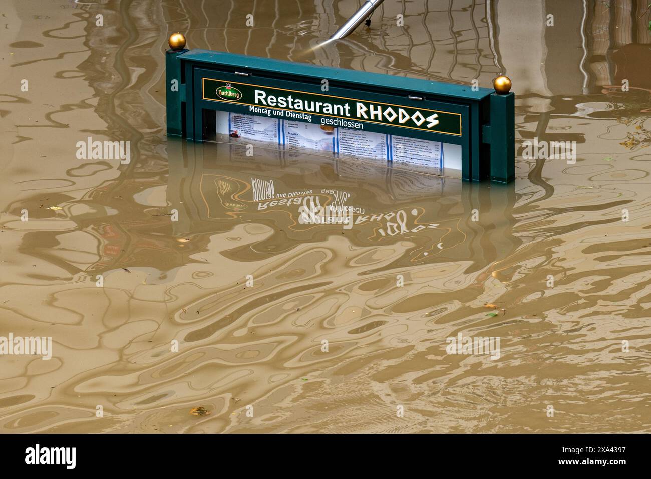 Passau, Germany. 04th June, 2024. A sign with the menu of a restaurant ...