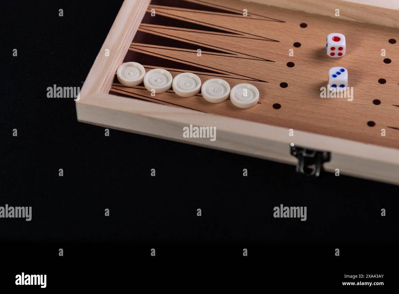 Traditional backgammon game. Board with backgammon game pieces on black ...
